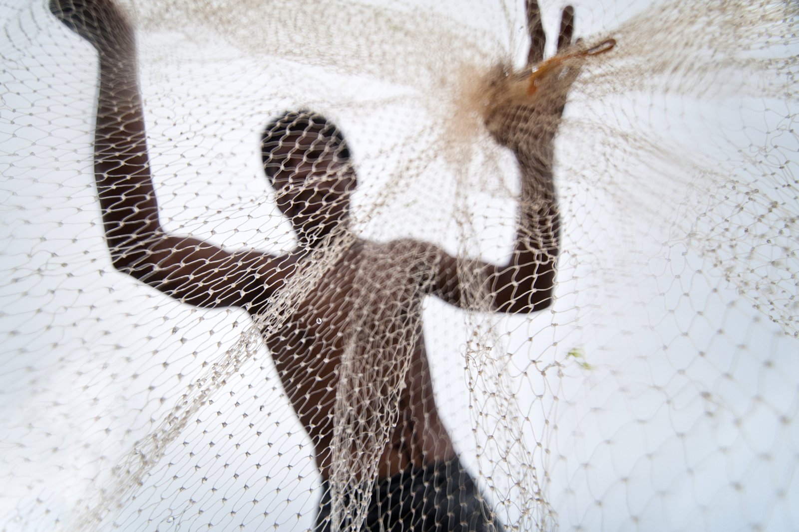 Fisherman bringing in a net | Jacob Maentz